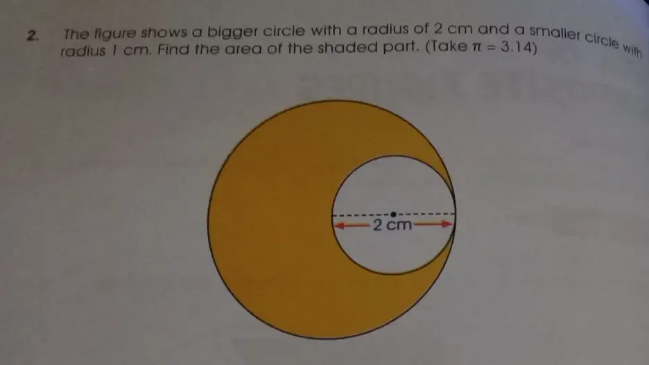 Solved: The figure shows a bigger circle with a radius of 2 cm maller ...